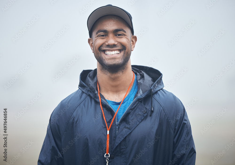 Shaping the athletes of the future. Shot of a young coach on the field ...