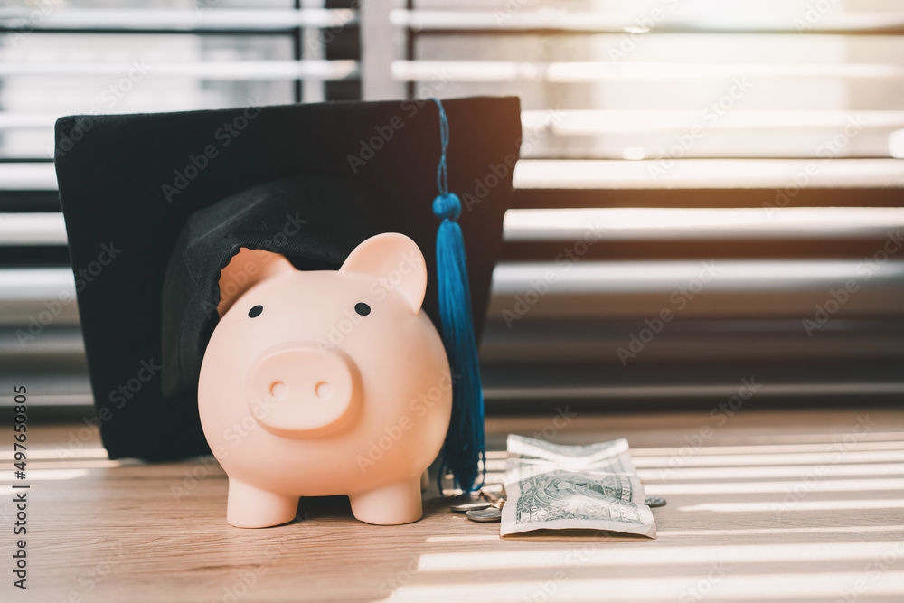 Black graduation hat and piggy bank concept investment in education ...