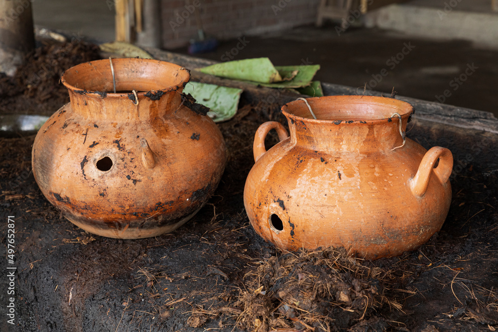 Clay pots used for the mezcal distillation process Stock Photo | Adobe ...