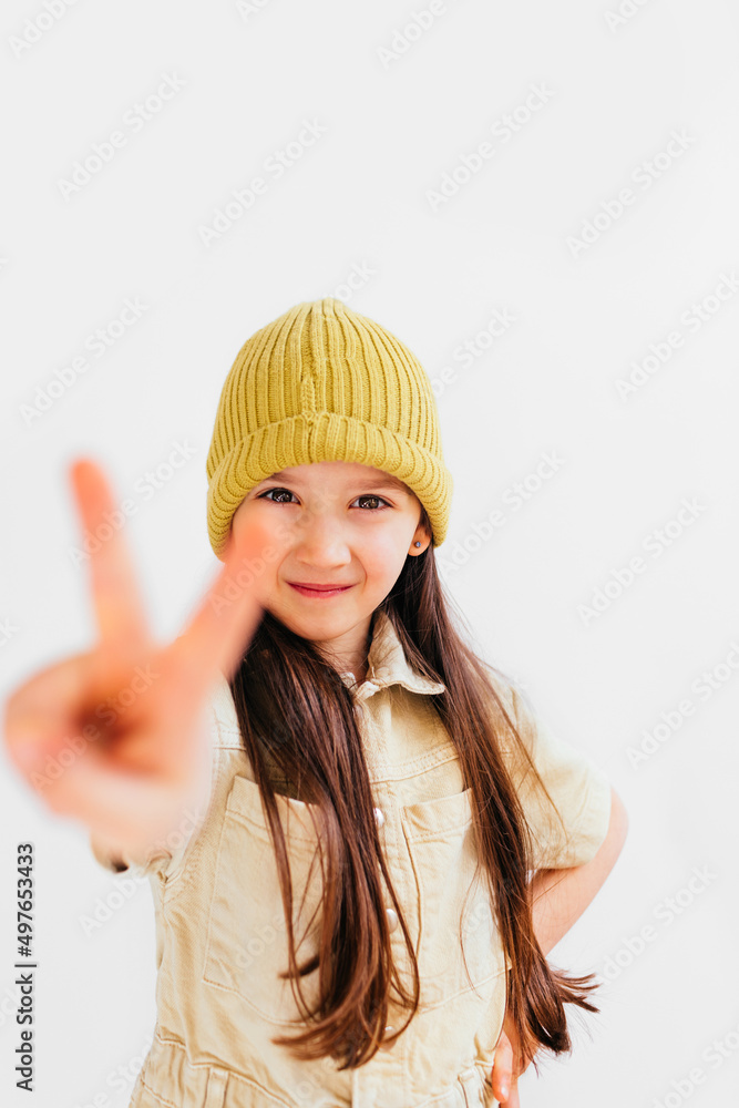 Little Girl Holding V Sign Stock Photo | Adobe Stock