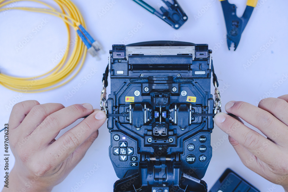 Internet technicians are measuring light signals using power meter ...