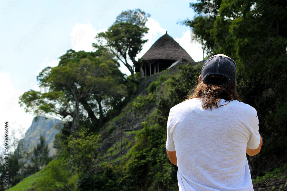 A tourist traveling in the districts of Timor Leste looking at a ...