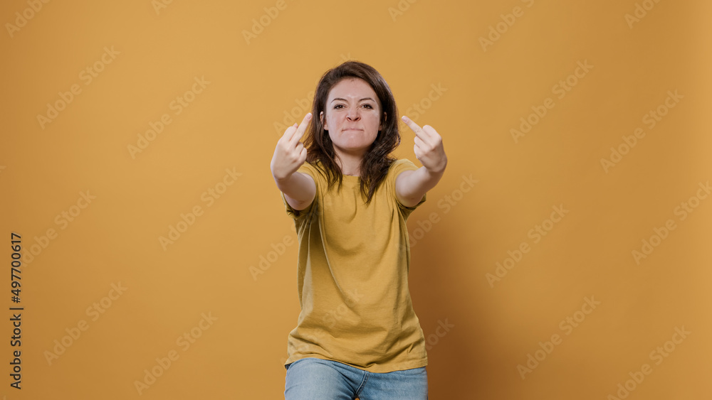 Angry woman showing middle finger obscene hand gesture having ...