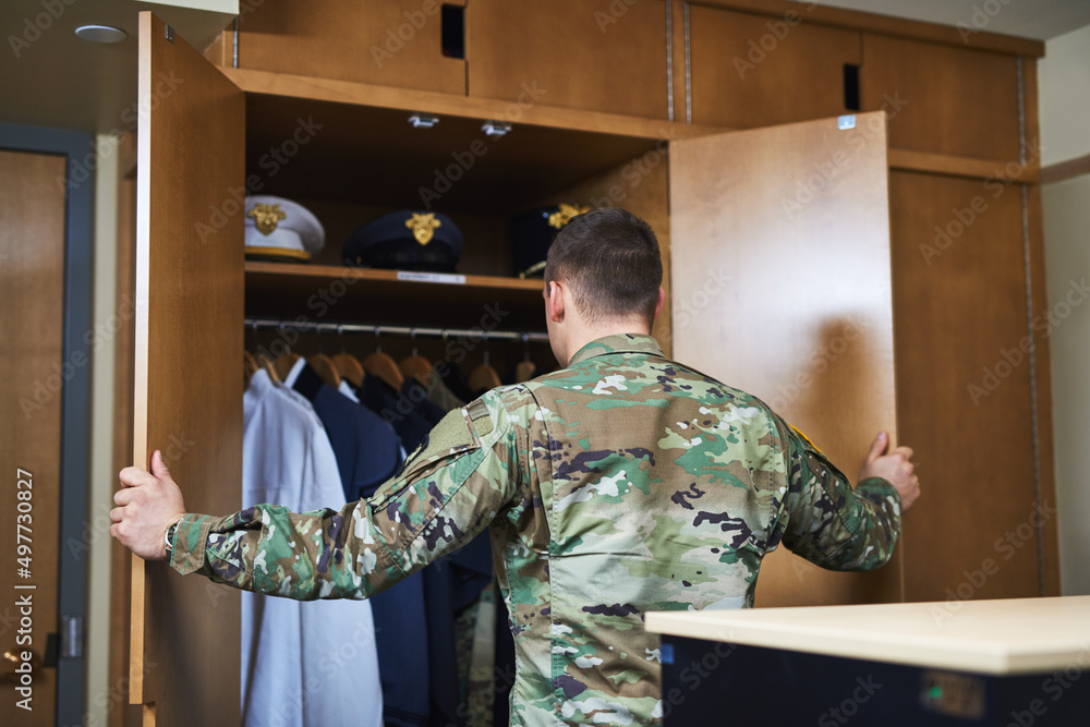 Discipline is a choice made daily. Shot of a young soldier standing ...