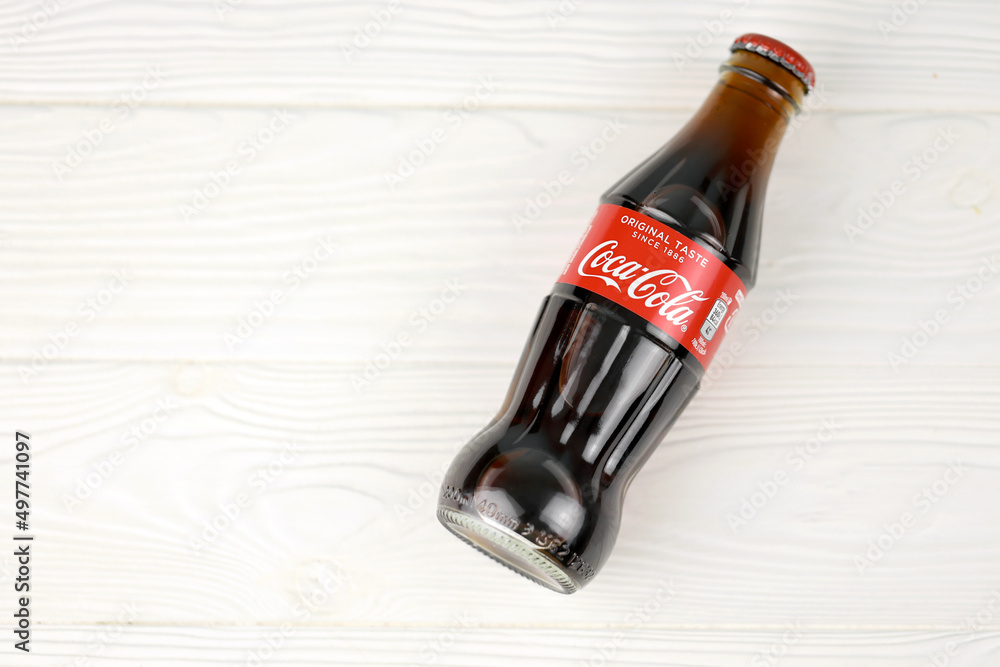 KHARKIV, UKRAINE - DECEMBER 16, 2021: Coca Cola production with classic ...