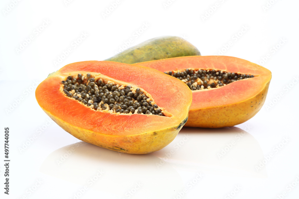 whole and half of ripe papaya fruit with seeds isolated on white ...