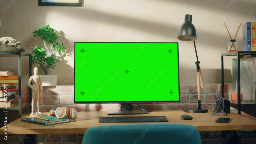 Desktop Computer Monitor Standing on a Desk with a Green Screen ...