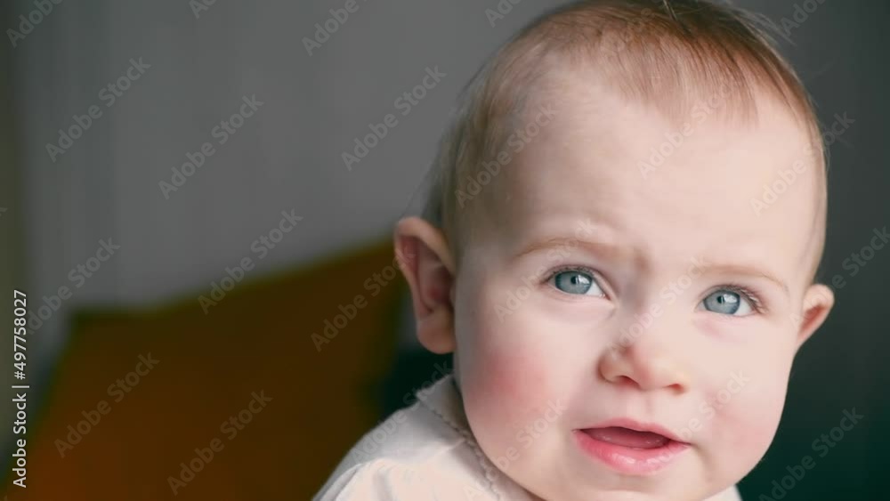 Serious baby face close up. Pensive Baby child in daylight. Emotion of ...