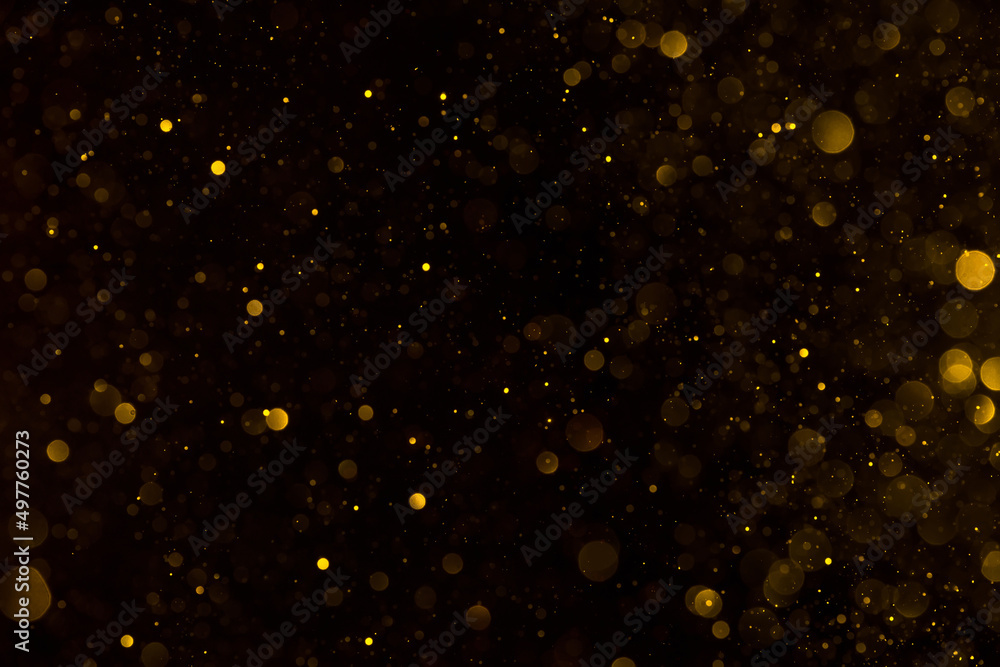 Abstract shiny golden glitter particles bokeh lights defocused background Stock Photo | Adobe Stock