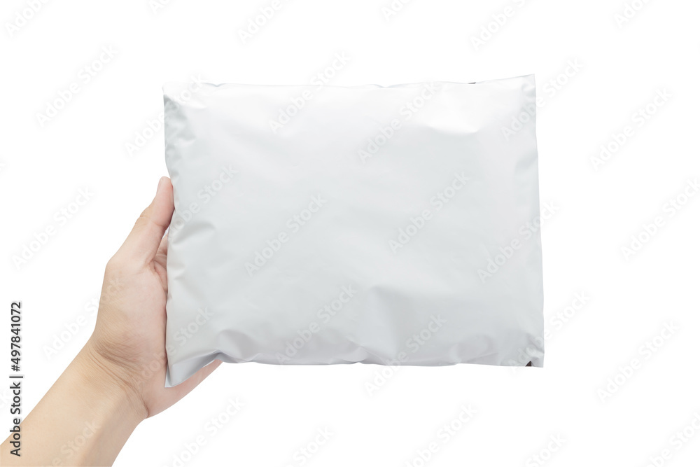 Hand holding blank white plastic bag package mockup template isolated ...