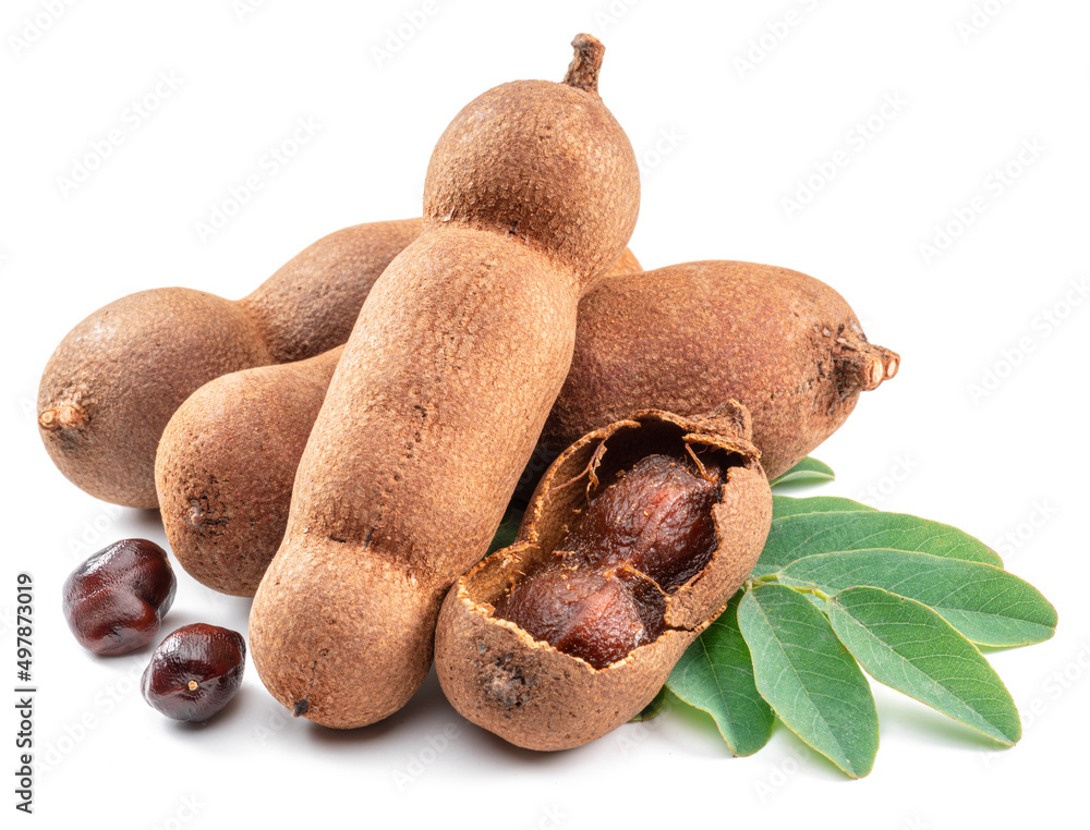 Ripe tamarind fruit, leaves and some tamarind seeds isolated on white ...