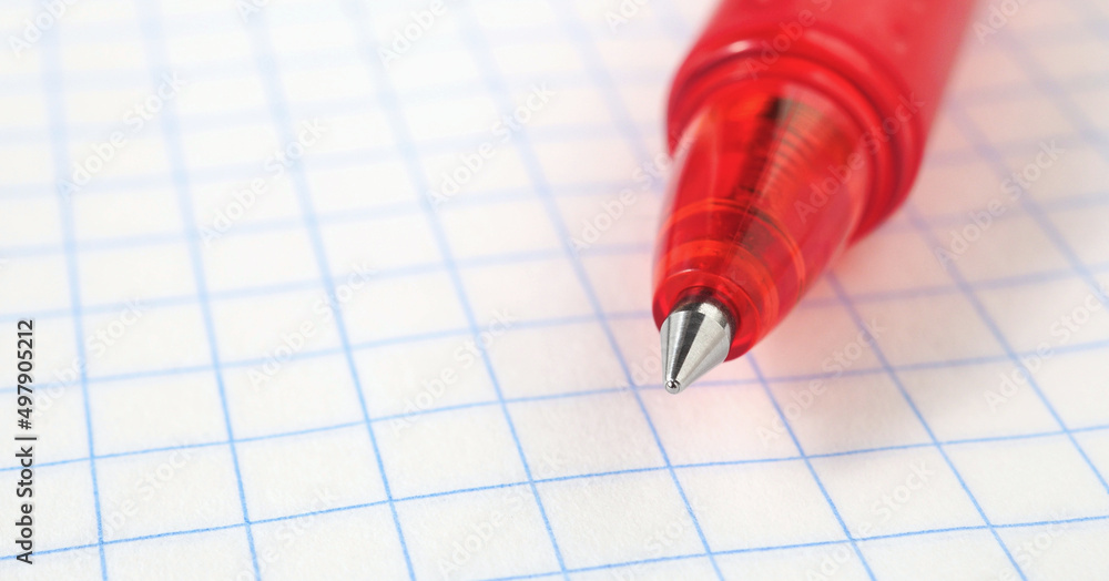 Red pen and grid copybook sheet closeup. Illustration about new school ...