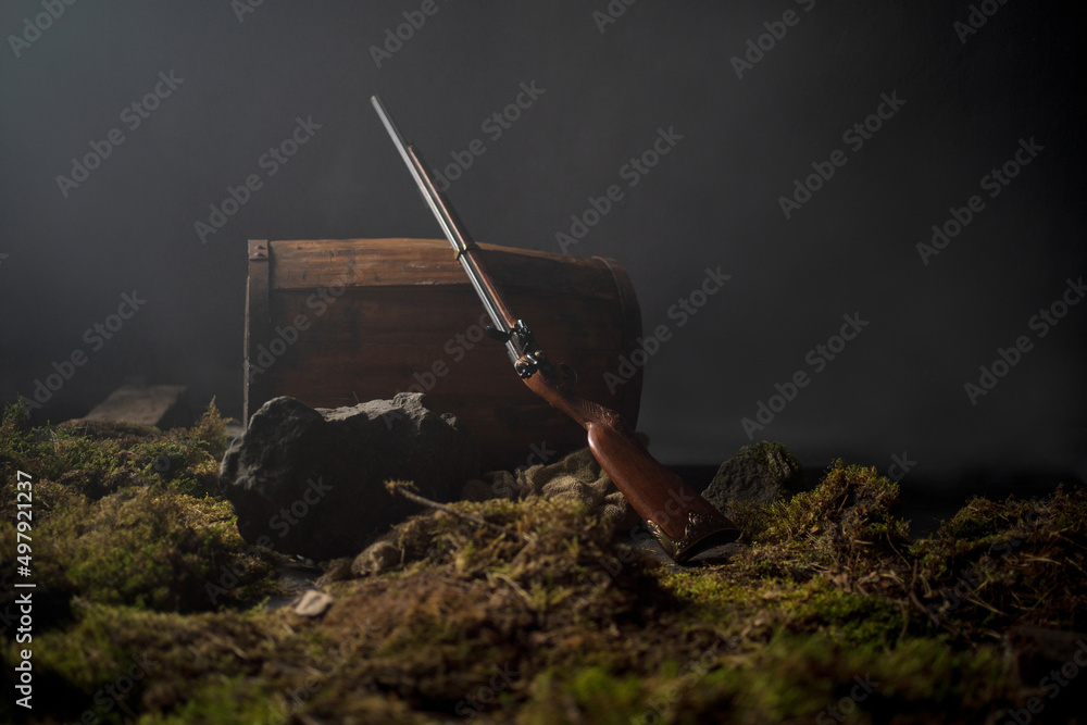 Photo & Art Print Ancient musket on a barrel among the smoke on the ...