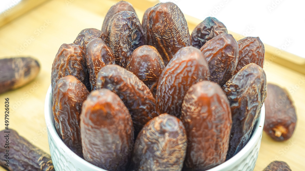 Dates also known as Khajur. Tasty dry dates isolated on white ...
