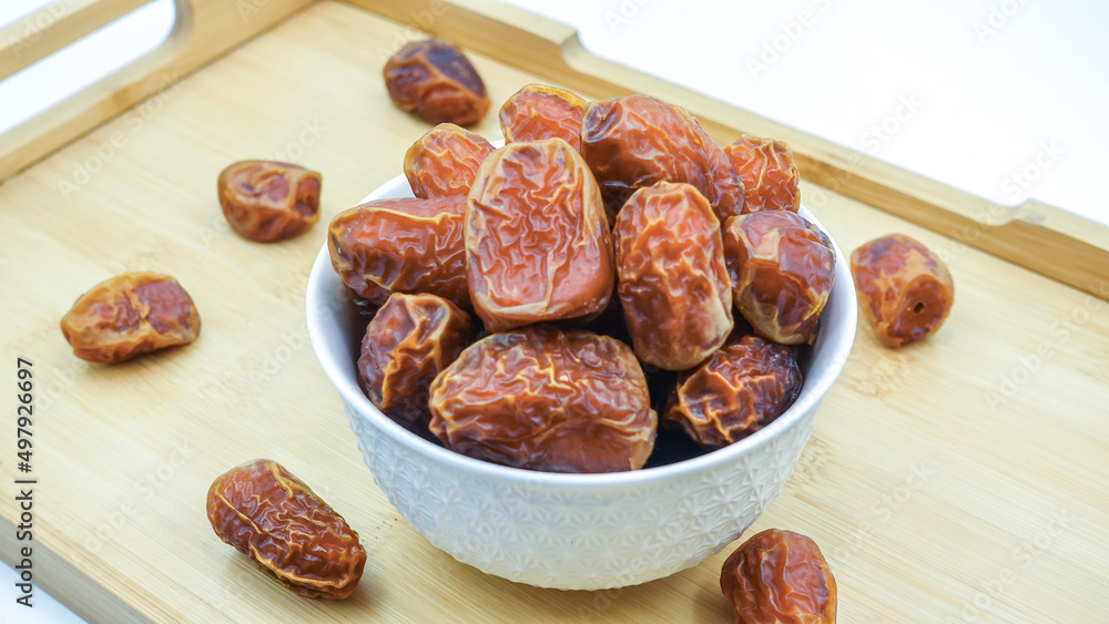 Dates also known as Khajur. Tasty dry dates isolated on white ...