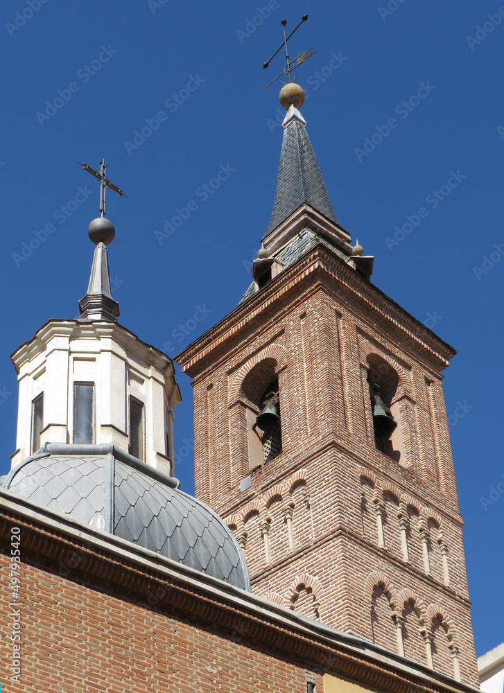 Bell tower decorated with trefoil and horseshoe arches. Islamic mudejar ...