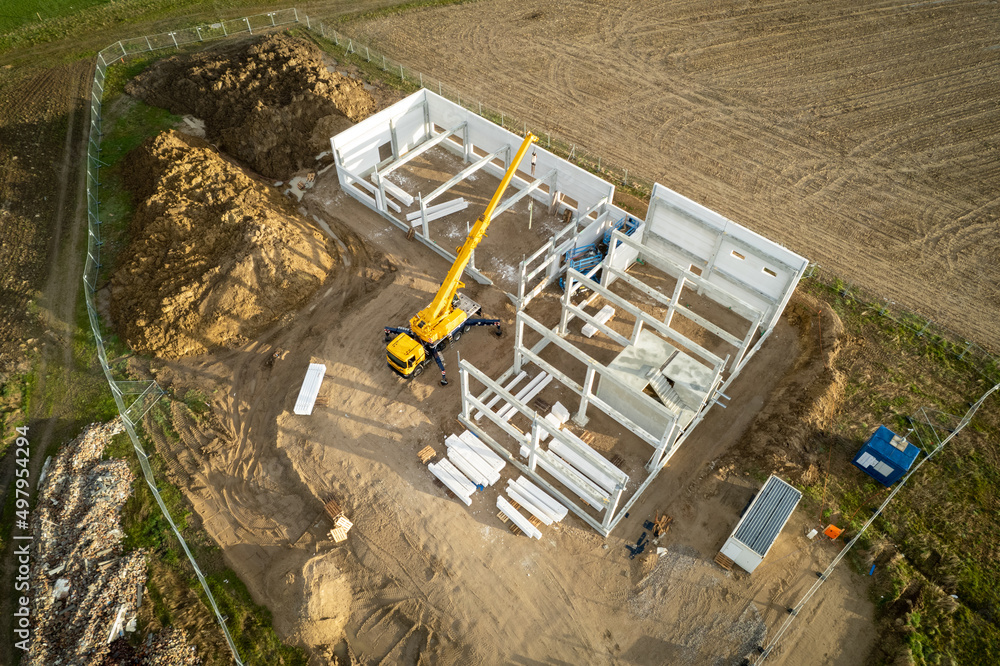 the basic structure of an industrial building is erected on a ...