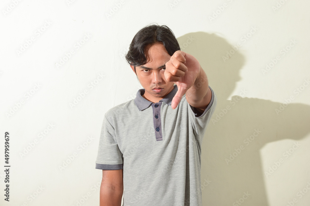 portrait of an Indonesian man. An Asian man's angry or glaring facial ...