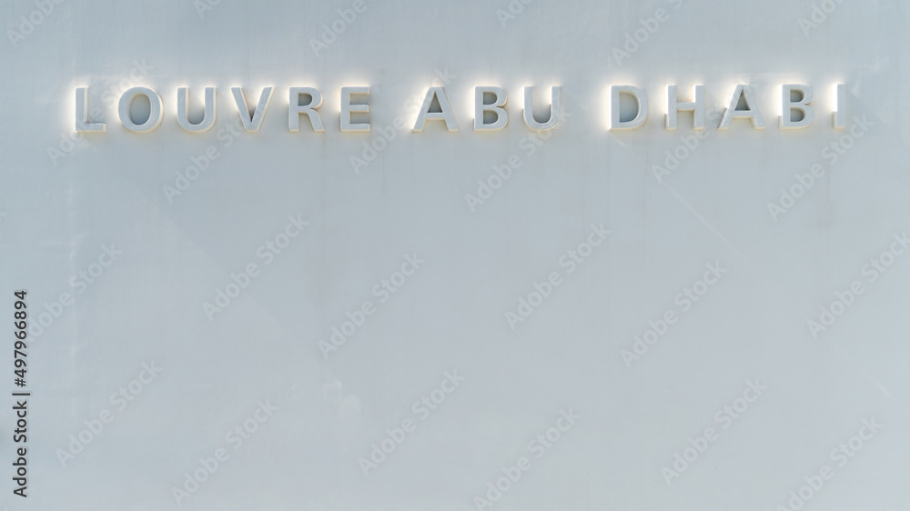 Abu Dhabi, UAE - February 2021: Louvre Abu Dhabi museum sign on a white ...