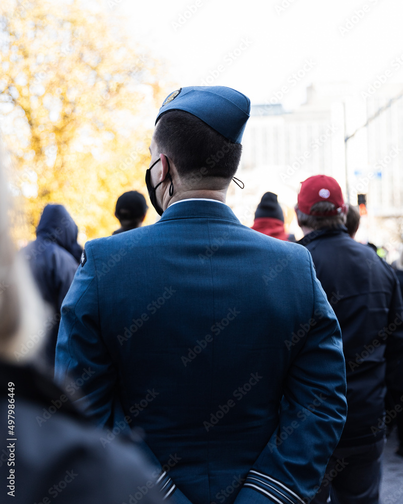 Remembrance Day Solemn Man in blue uniform at remembrance day ceremony ...