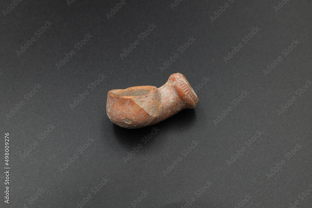 medieval clay smoking pipe on black background Stock Photo | Adobe Stock