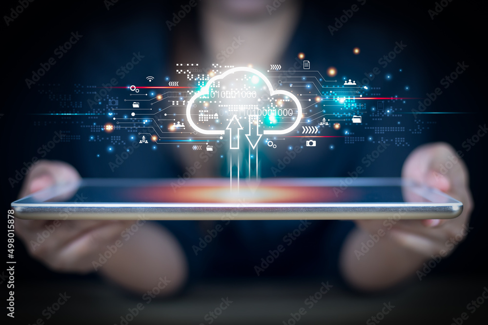 Businesswomen is using a tablet to access the cloud computing system ...
