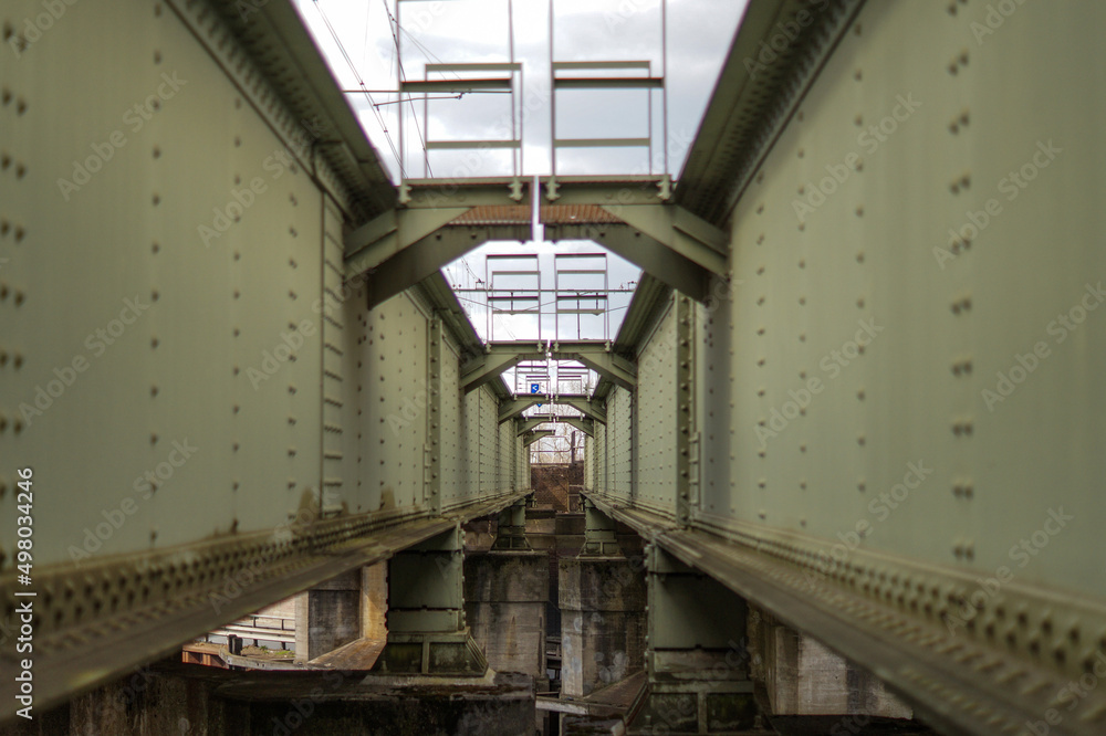 Metal plates on the side of a train railway urban one point perspective ...
