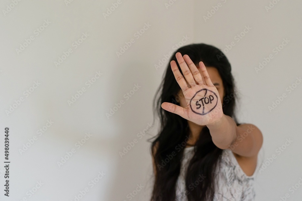 Woman showing stop sign on hand to empower, awareness about women ...