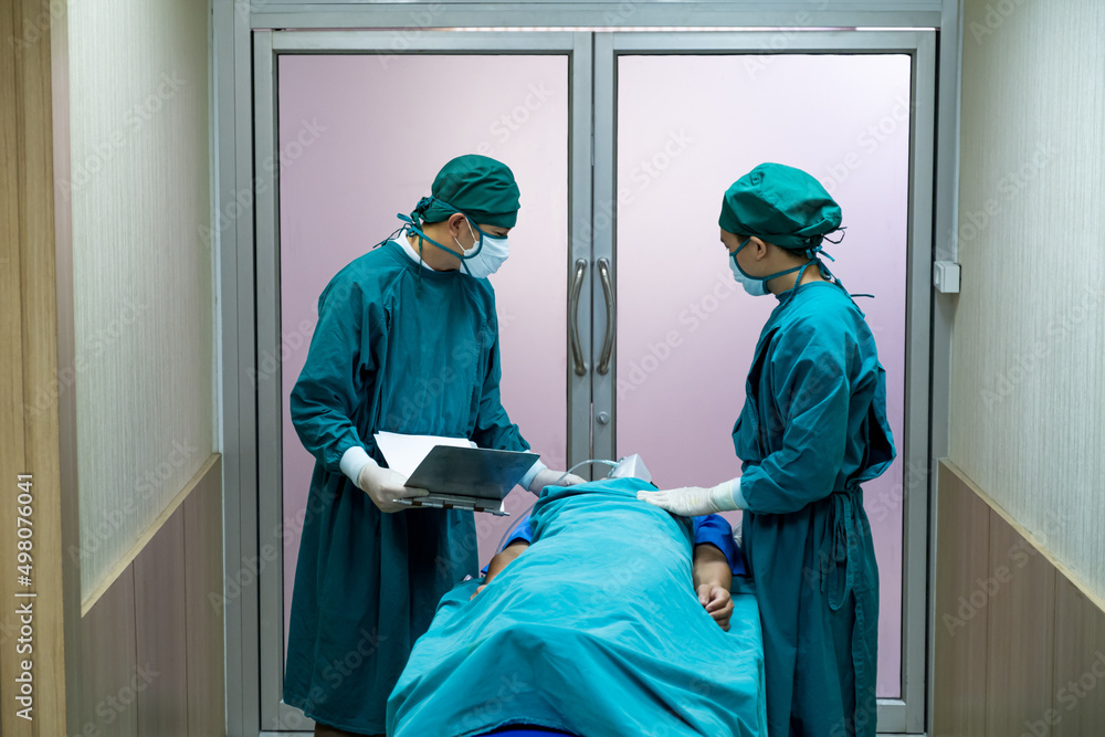 Selective focus at face of the doctor while moving out the body of pass ...