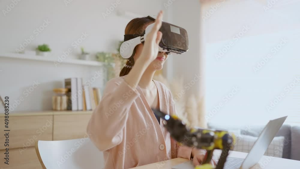 smart asian female programer wear vr control learning robot arm ai ...