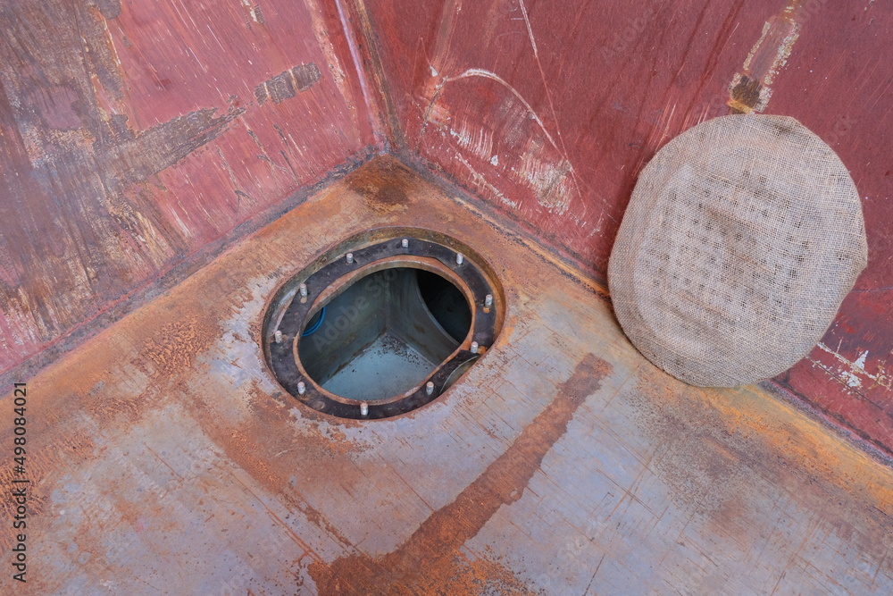 Bilge well in open condition with cover wrapped in burlap, inside cargo ... Bilge well in open condition with cover wrapped in burlap, inside cargo ...