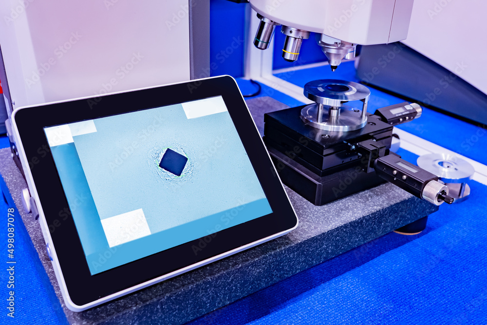 Electron microscope with digital panel. Tablet transmits data from ...