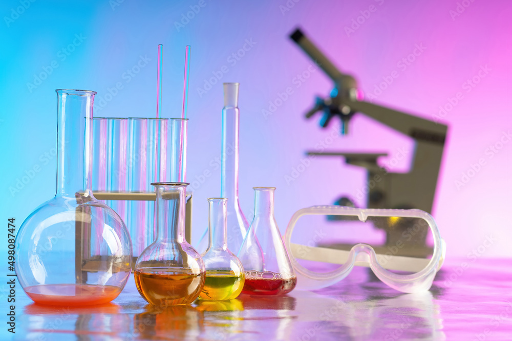 Laboratory glassware. Test tubes with multi-colored liquids. Flasks ...