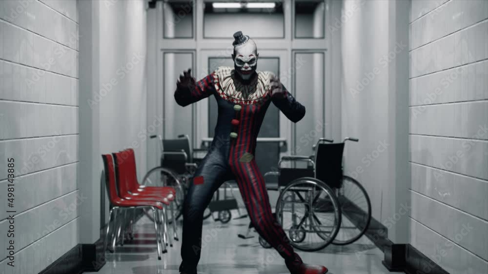 A creepy jester dances in a deserted hospital corridor. A clown dancing ...