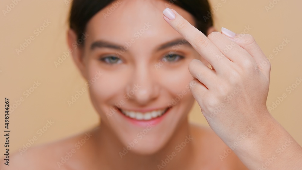 Close-up beauty portrait of young attractive woman shows a middle ...