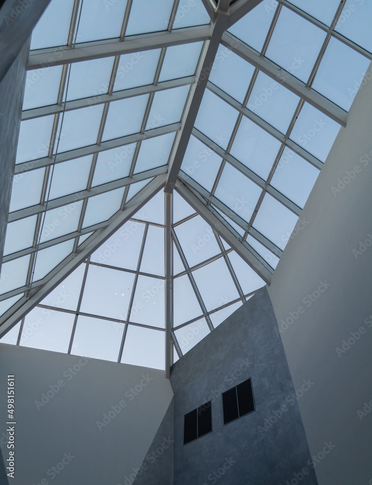 Triangle glass roof in a mall. Glass triangle glass roof and clear sky ...