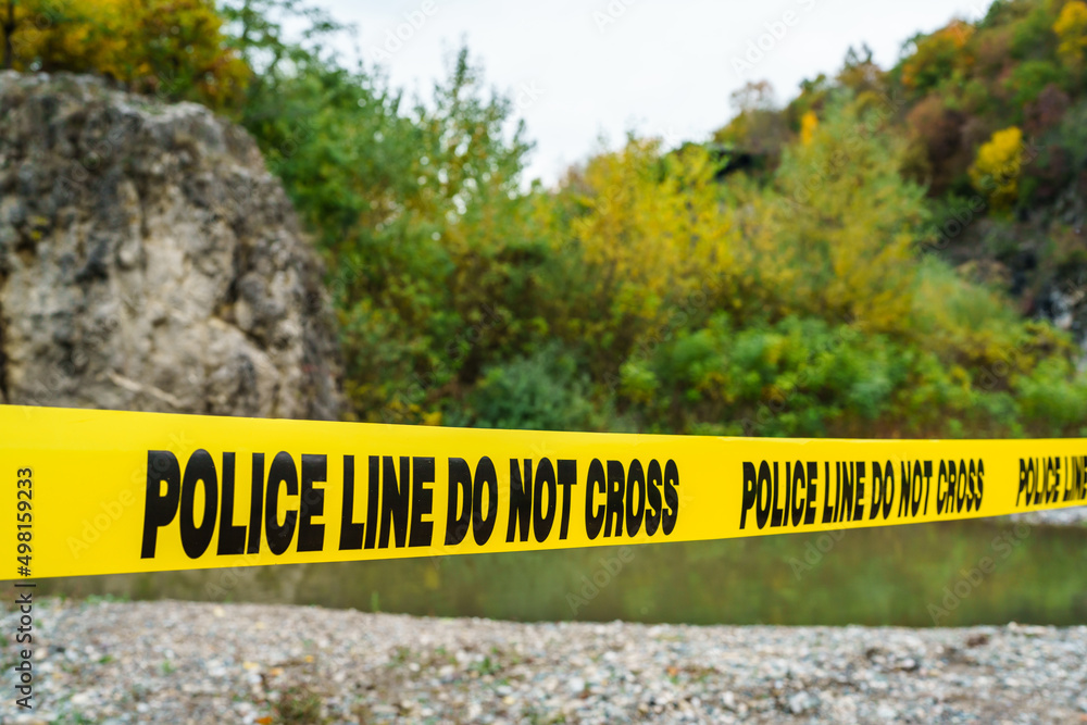 police line do not cross on the yellow tape securing crime scene in ...