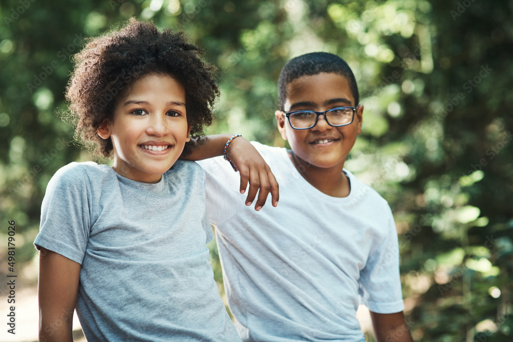 Best buds make summer camp even better. Shot of two teenage boys ...
