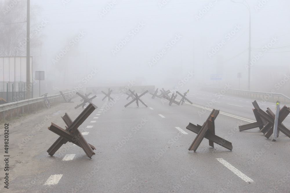 War in Ukraine 2022. Tank barriers on the road. Anti-tank structures ...