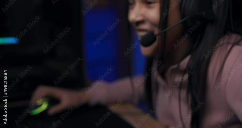 Hands of a young girl playing on professional color backlit keyboard ...
