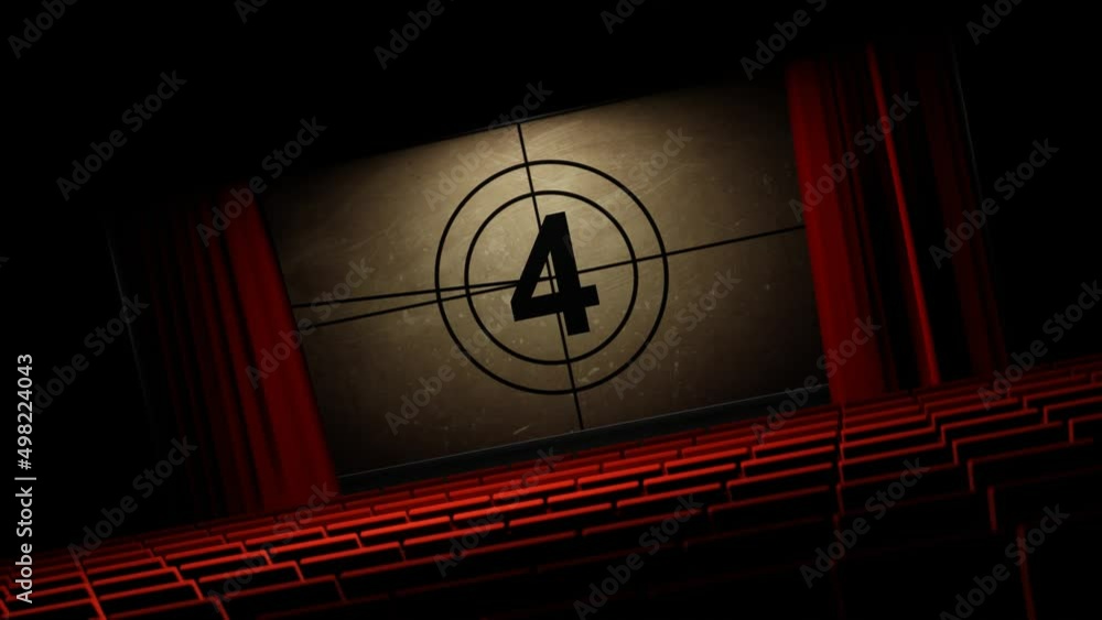 Camera moving toward movie theater countdown screen. After zero screen ...