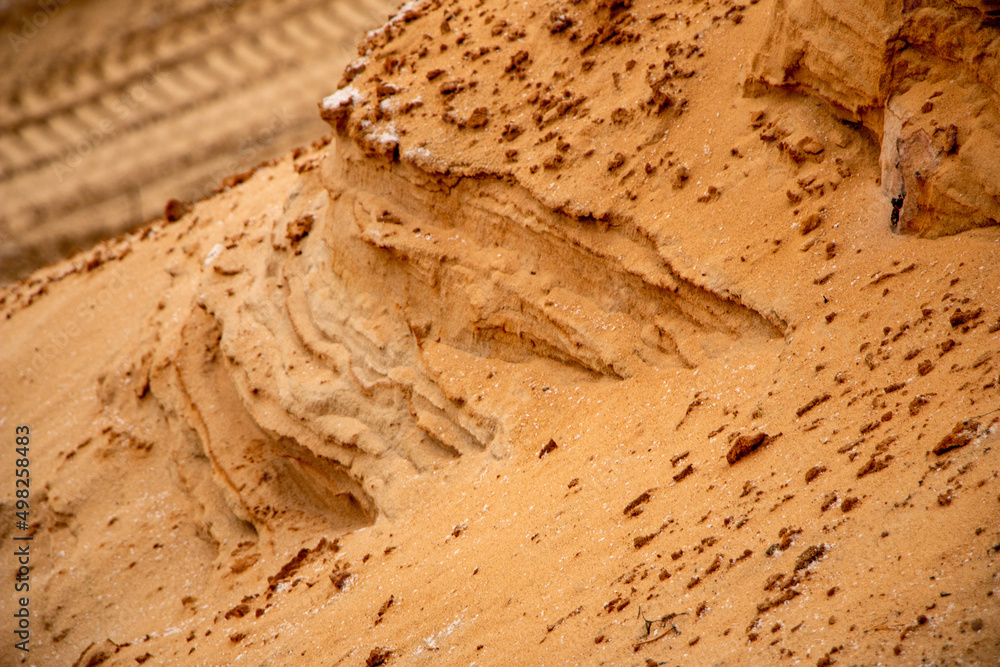 Textural sand, with relief surface, multi-colored layers and different ...