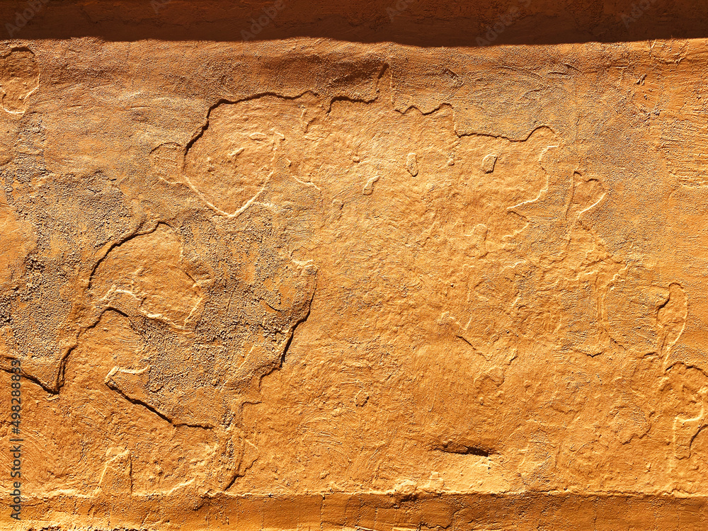 cave wall ancient caveman carving canyon cliffs mud hut closeup ...