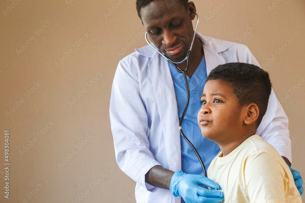 african american man pediatrician doctor using stethoscope to examining ...