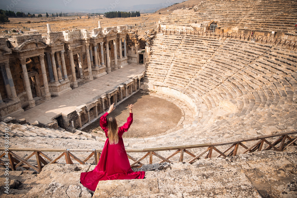 Hierapolis ancient city Pamukkale Turkey, woman in red dress background ...