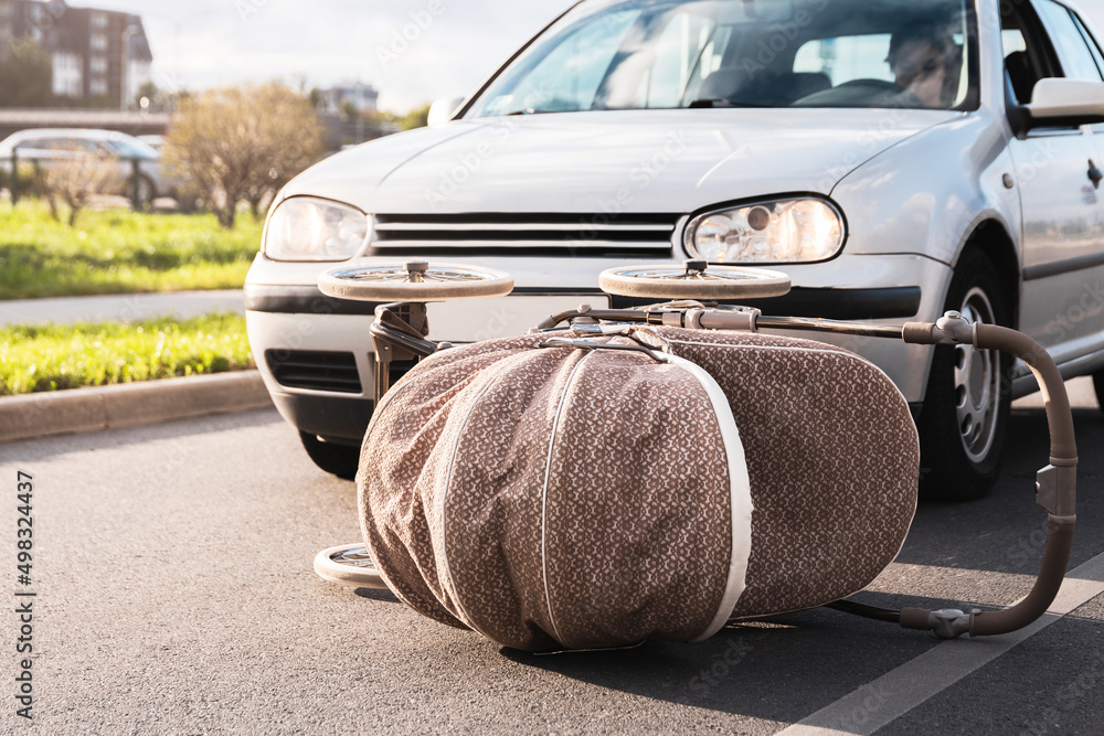 Vehicle hits the baby pram on the road. Car accidents are the cause of ...