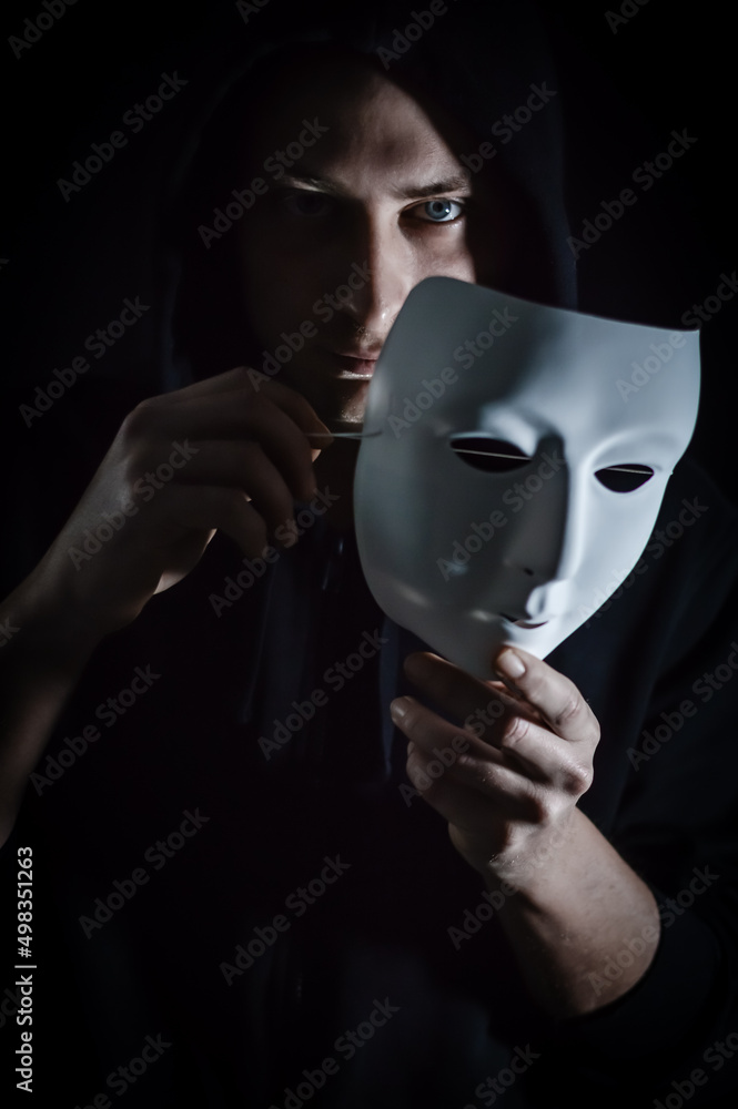 Take Off The Mask Portrait Of A Young Hooded Man Who Takes Off His Mask Letting His Gaze Be