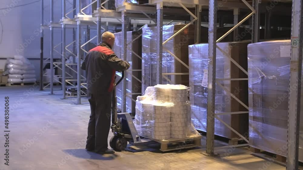 Injury at work. Warehouse worker lying unconscious on the concrete ...