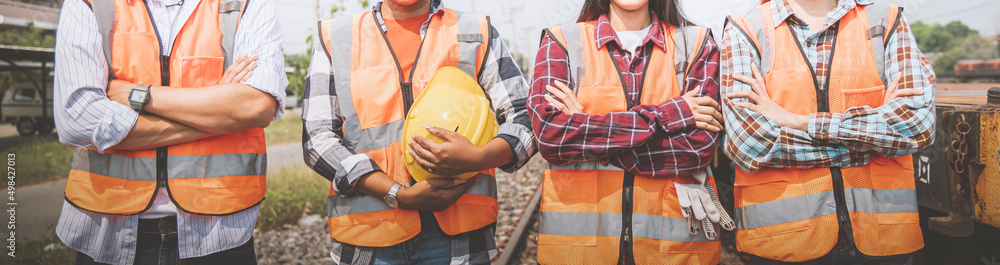 Professional railway engineer team stand with crossed arms in line ...