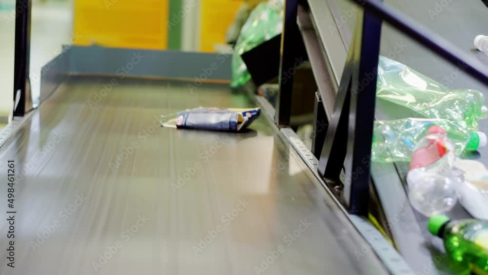 Waste sorting with a mechanical manipulator. Stock Video | Adobe Stock